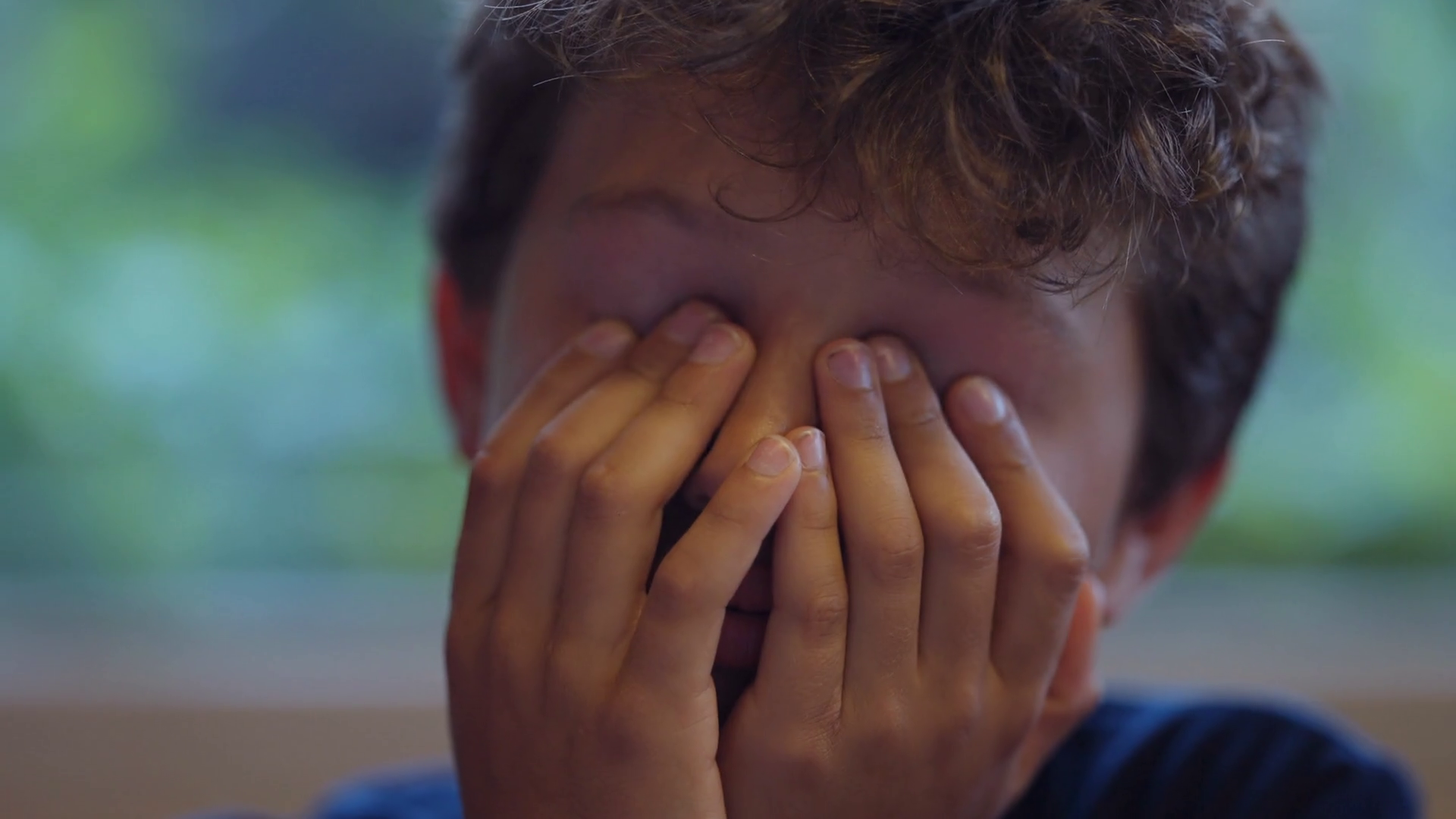 Worried Young Boy Covering Face With Hand Stock Footage SBV-348899786 ...