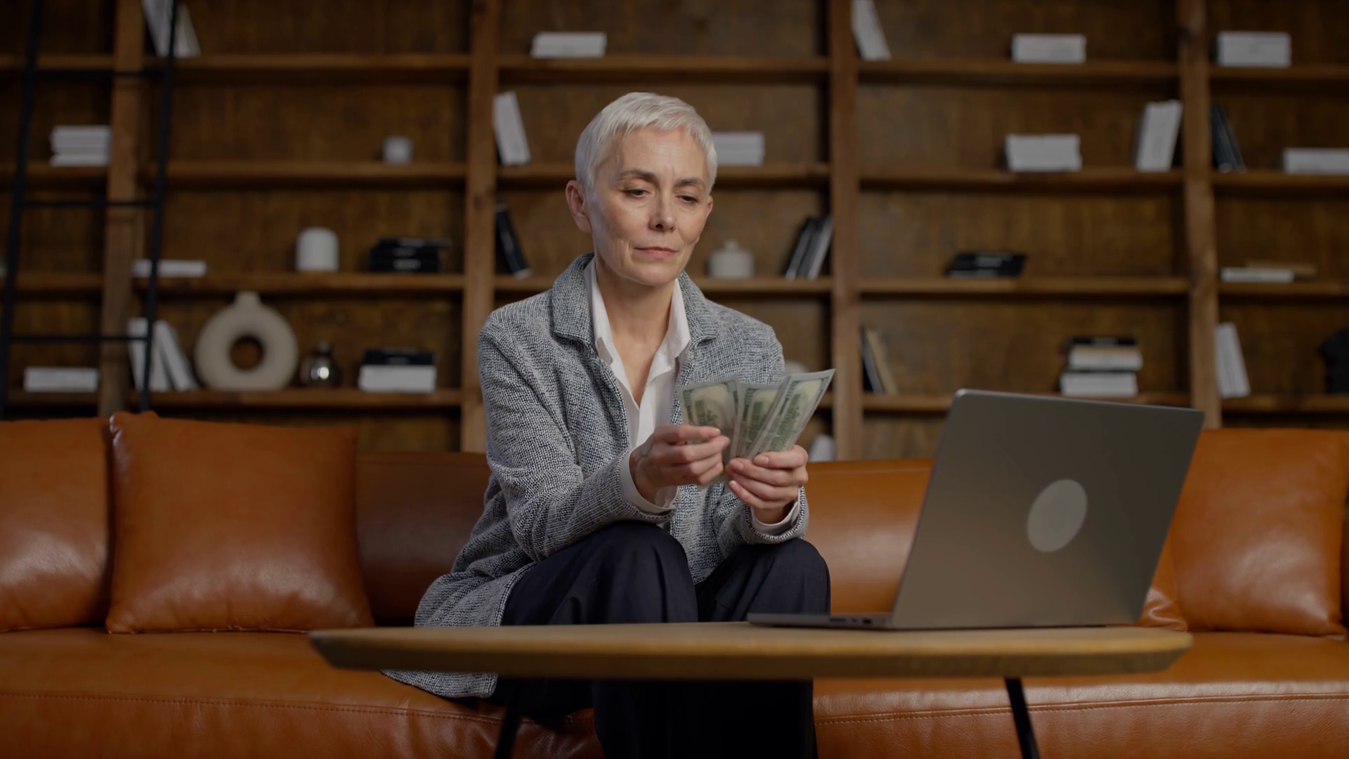 Senior Businesswoman Counting Cash In Office Stock Footage SBV ...