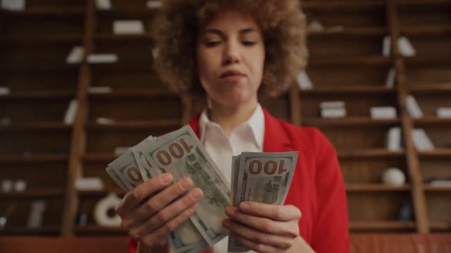 Woman Dollar Stock Footage: Royalty-Free Video Clips - Storyblocks