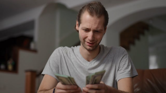 Man Losing Money Stock Footage: Royalty-Free Video Clips - Storyblocks