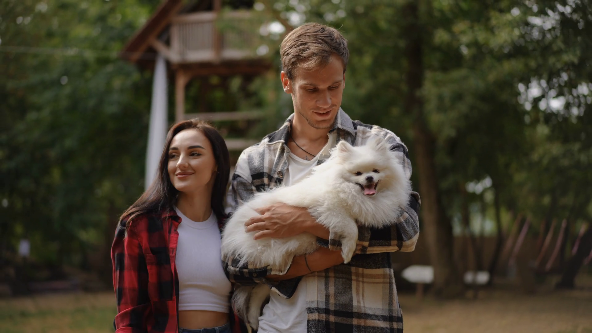 A Couple Happily Poses With Adorable Fluffy Stock Footage SBV-352018343 ...