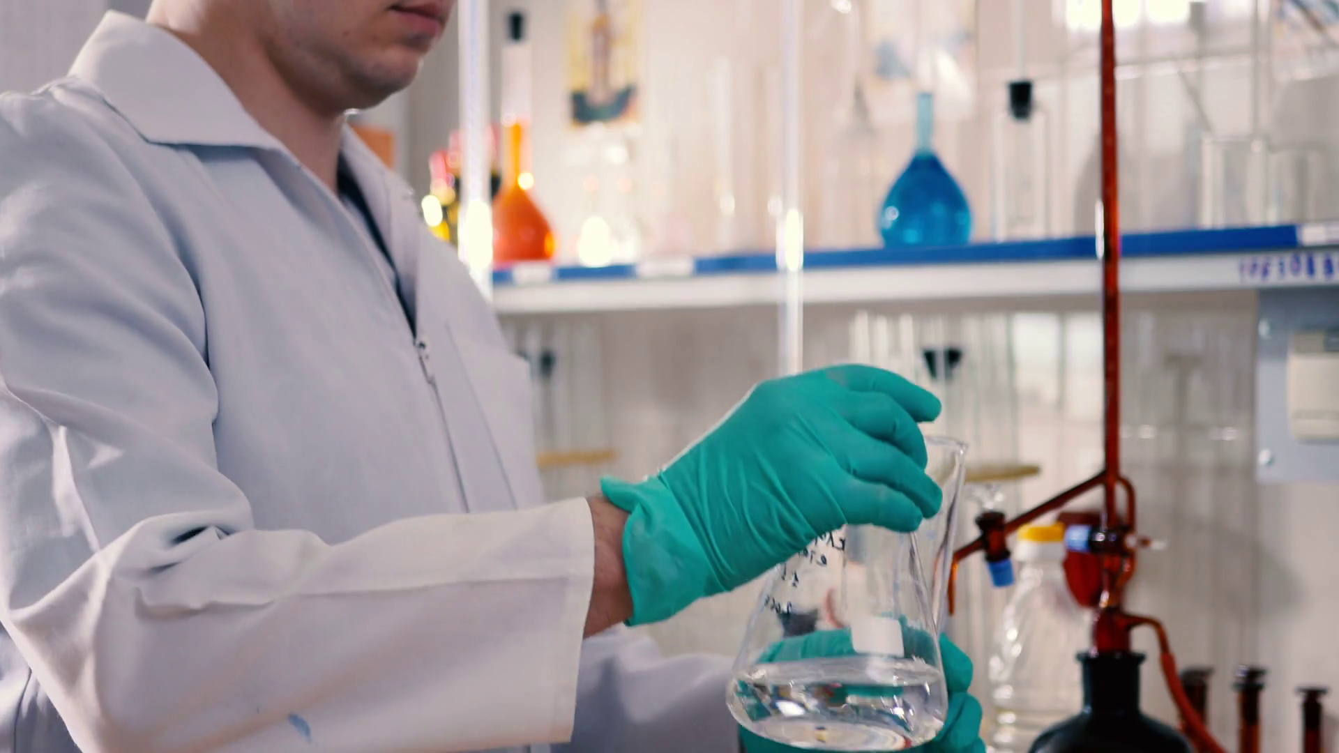 Pour the liquid from the flask into a beaker Stock Video Footage 00:39 ...