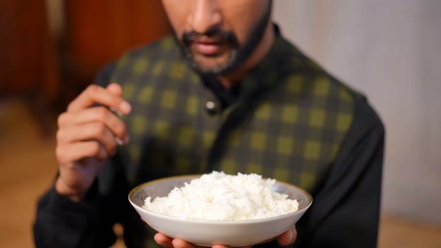 Man Eating Rice Stock Footage: Royalty-Free Video Clips - Storyblocks