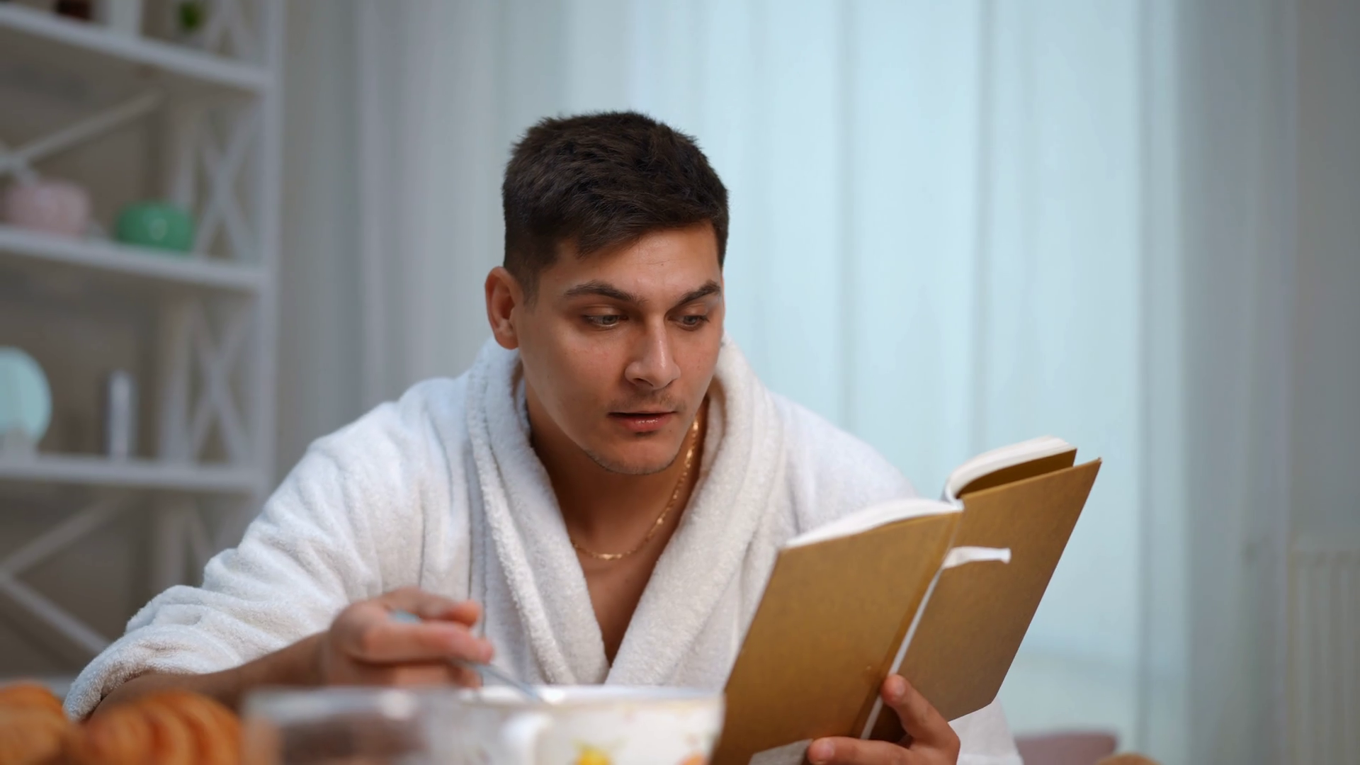Enjoy Reading Book Eating Young Man In White Stock Footage SBV ...