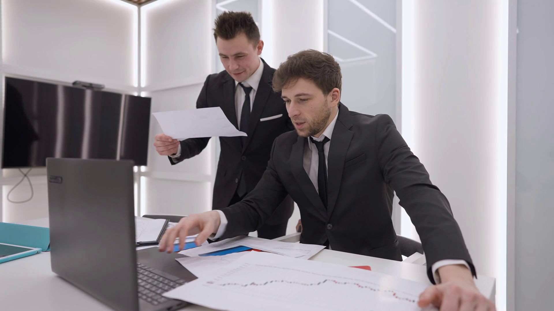 Two positive professional Caucasian male analysts talking smiling ...