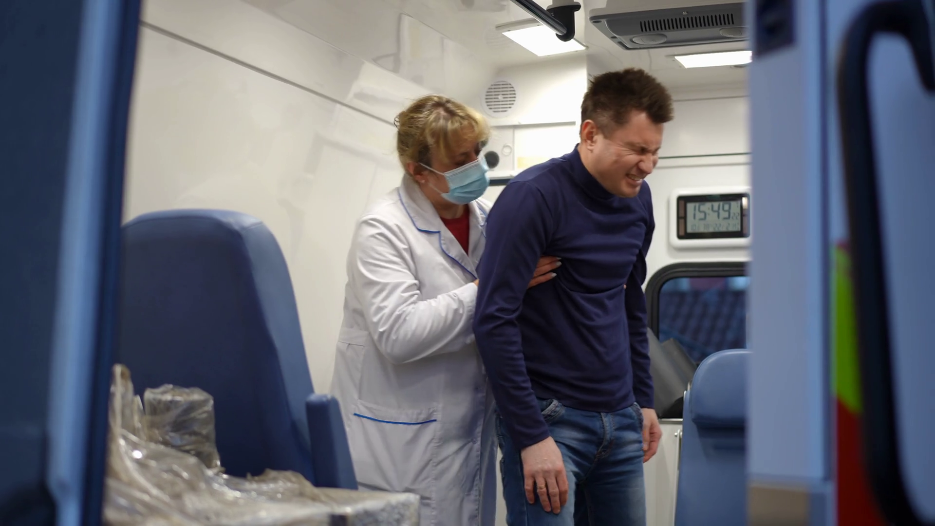 Paramedic Helps Man With Leg Injury To Sit Stock Footage SBV-348614165 ...