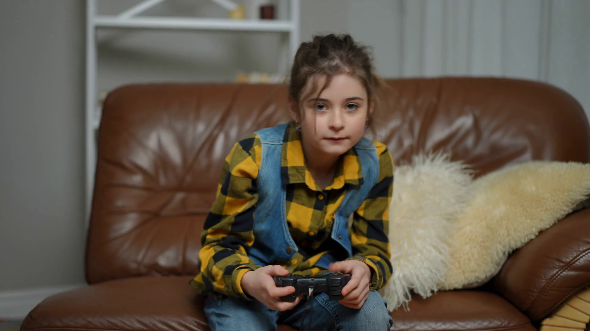 A Cheerful Girl Plays On Console With Stock Footage SBV-348837797 ...