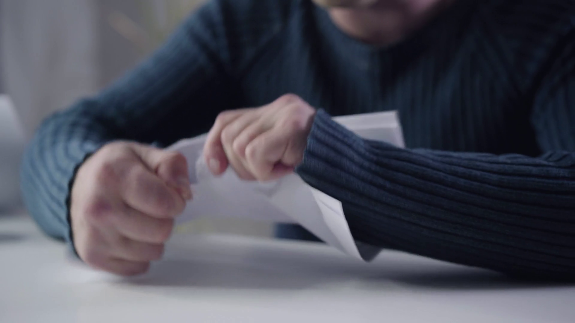 Close-up of male Caucasian hands tearing papers. Stressed adult man ...