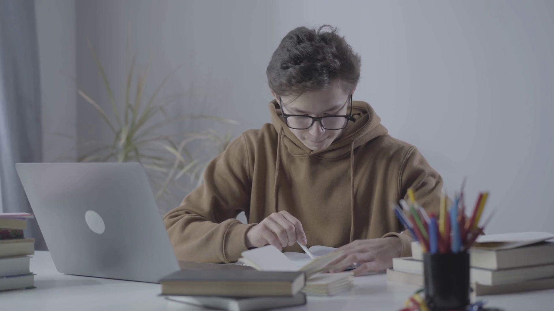 Front view of nervous stressed teenager throwing crumpled paper to ...