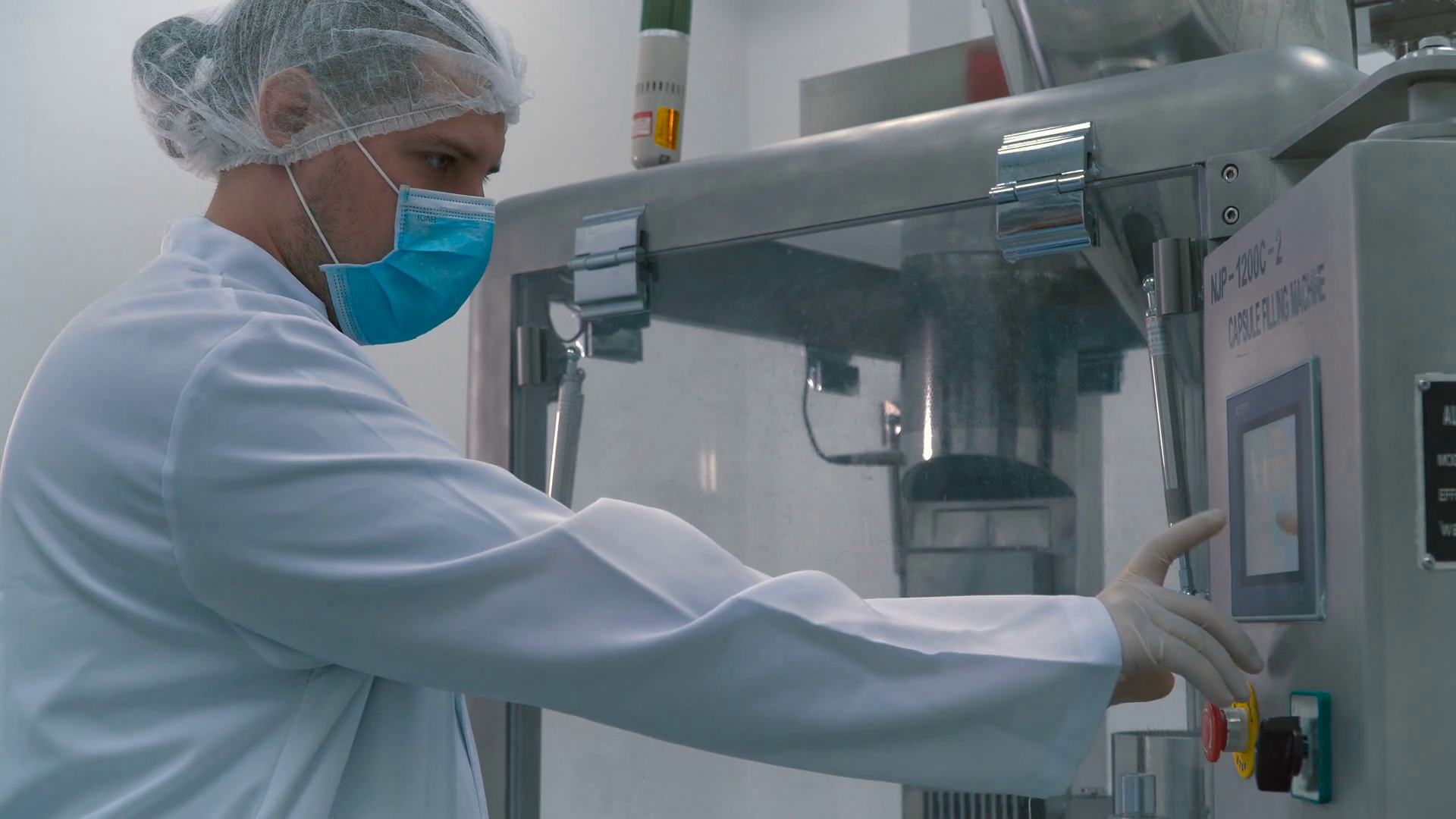 Laboratory worker pushing buttons at the machine in laboratory Stock ...