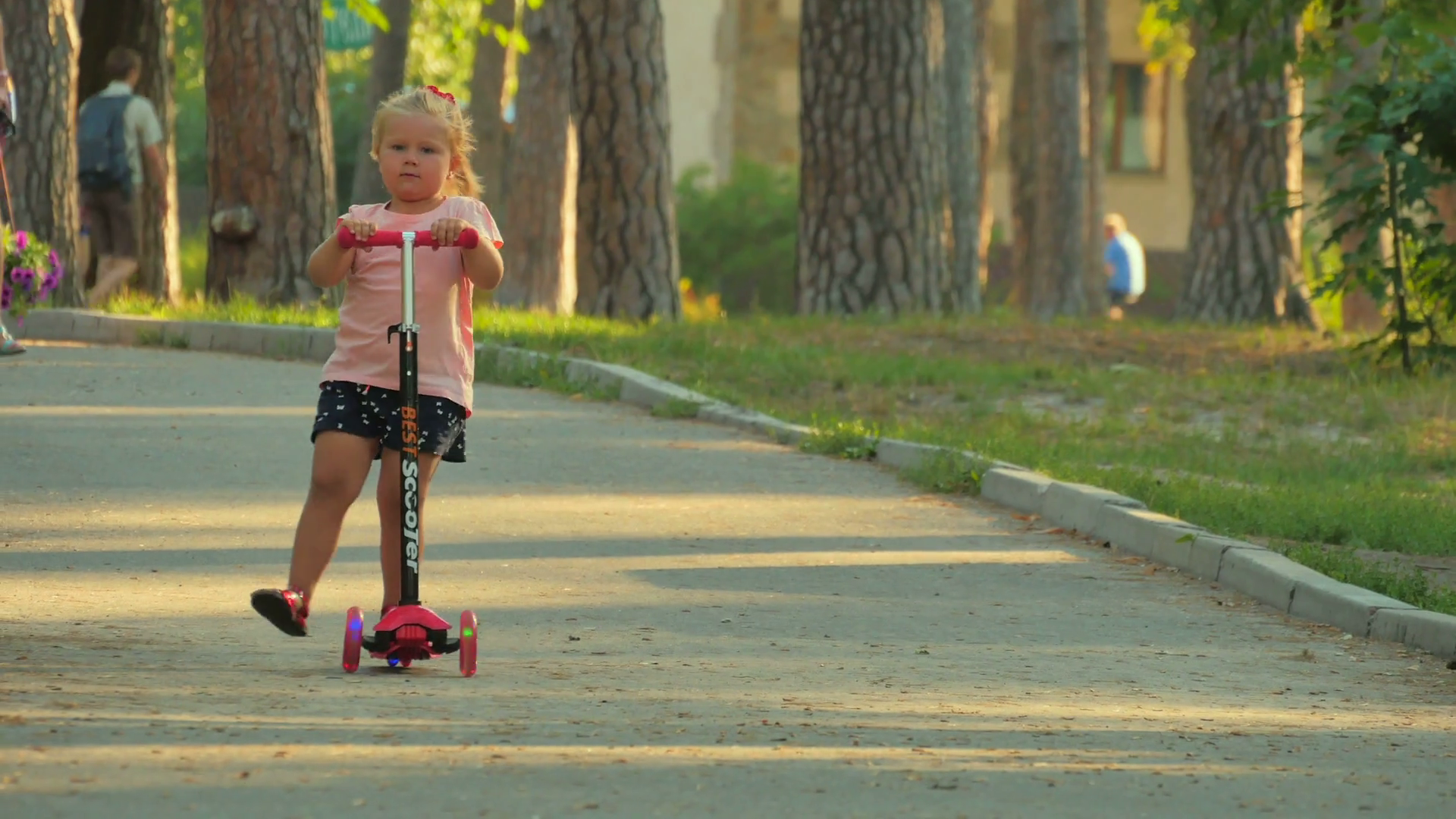 Child Riding Scooter In Park Stock Footage SBV-317058655 - Storyblocks
