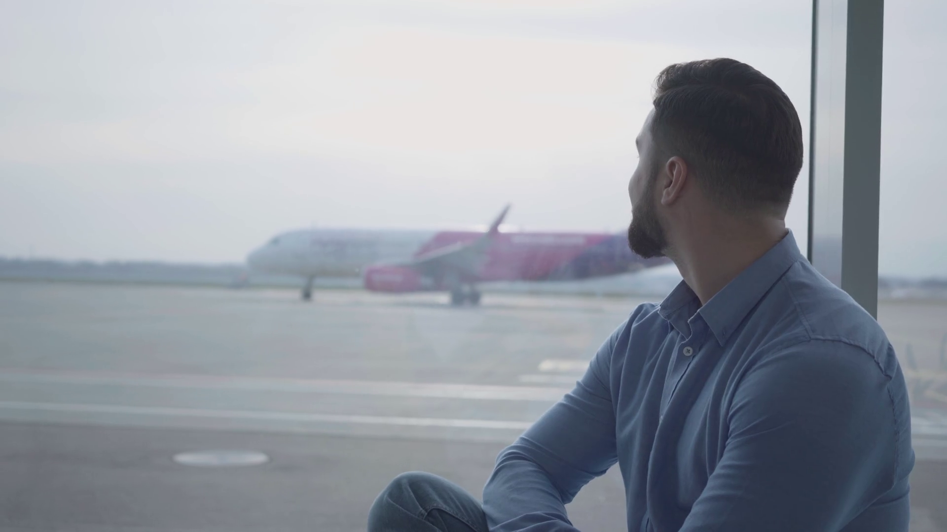 Close-up Of Man Watching Airplane Takeoff At Stock Footage SBV ...