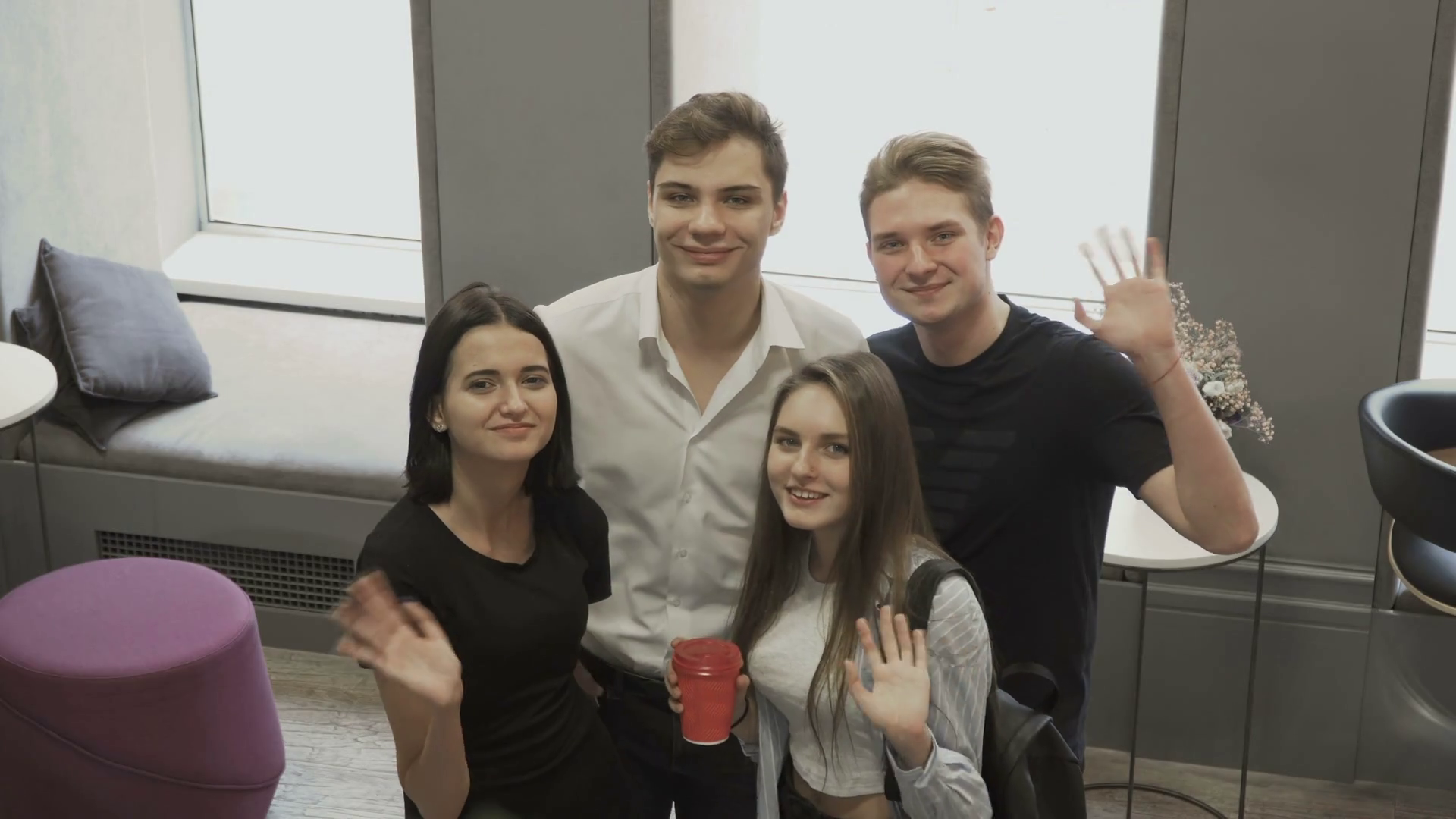 Team Of Four People Wave Hands To Camera Stock Footage SBV-318420014 ...