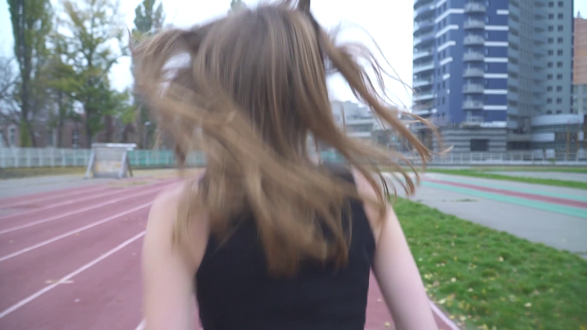 The Camera Moves Behind Girl Running Stock Footage SBV-329532717 ...
