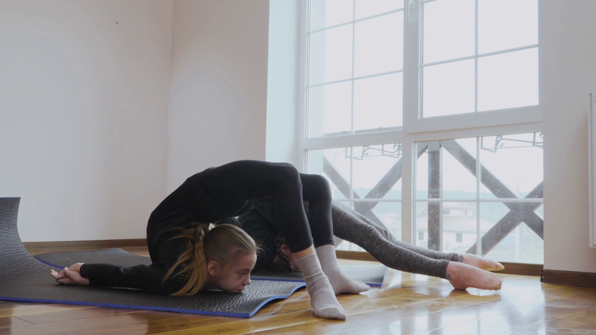 Two Girls Makes Stretching Exercises In Room Stock Footage SBV ...