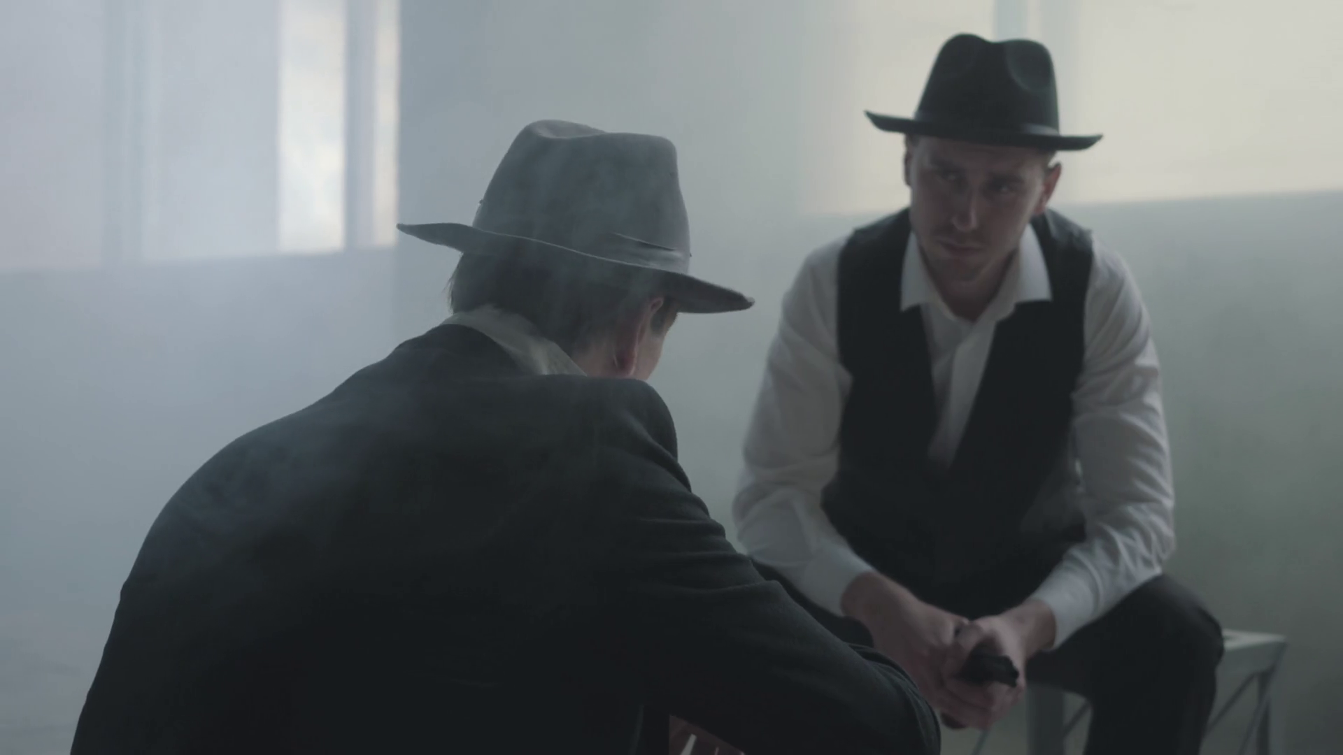 Two Stylish Men In Hats Sitting In Abandoned Stock Footage SBV ...