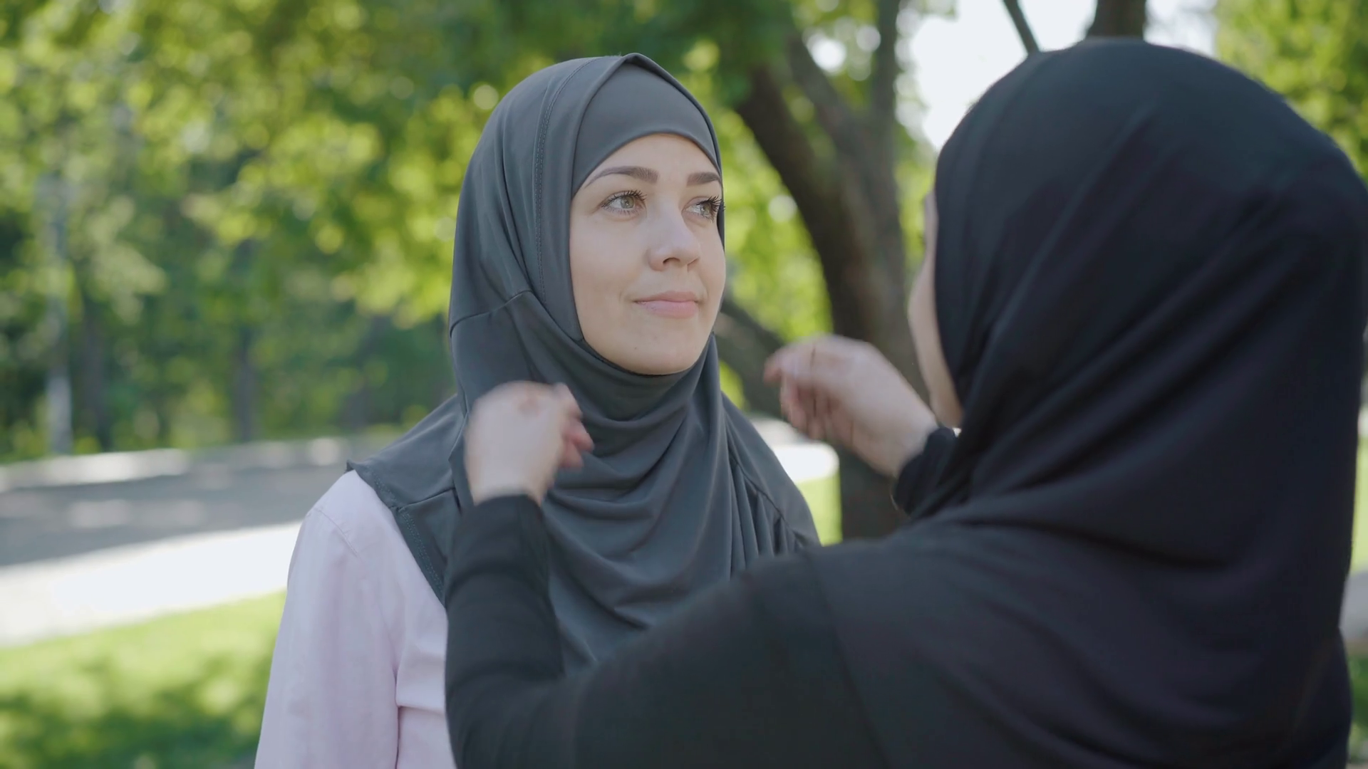 Woman Adjusting Hijab Of Smiling Young Lady Stock Footage SBV-338618261 ...