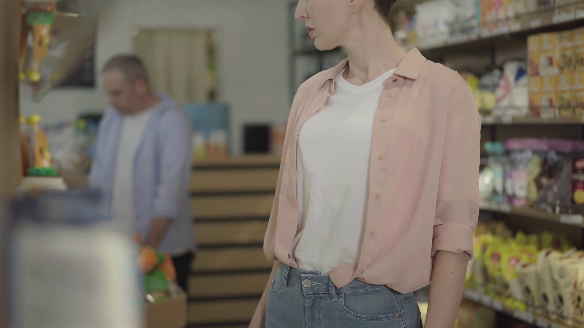 Unrecognizable Young Female Robber Stealing Goods In Grocery Caucasian
