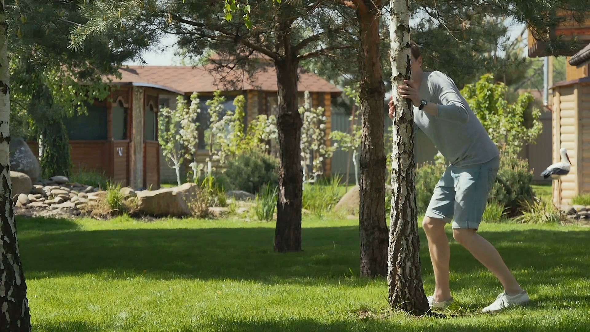 Young Man Runs Through Lawn In Garden Stock Footage SBV-315794114 ...