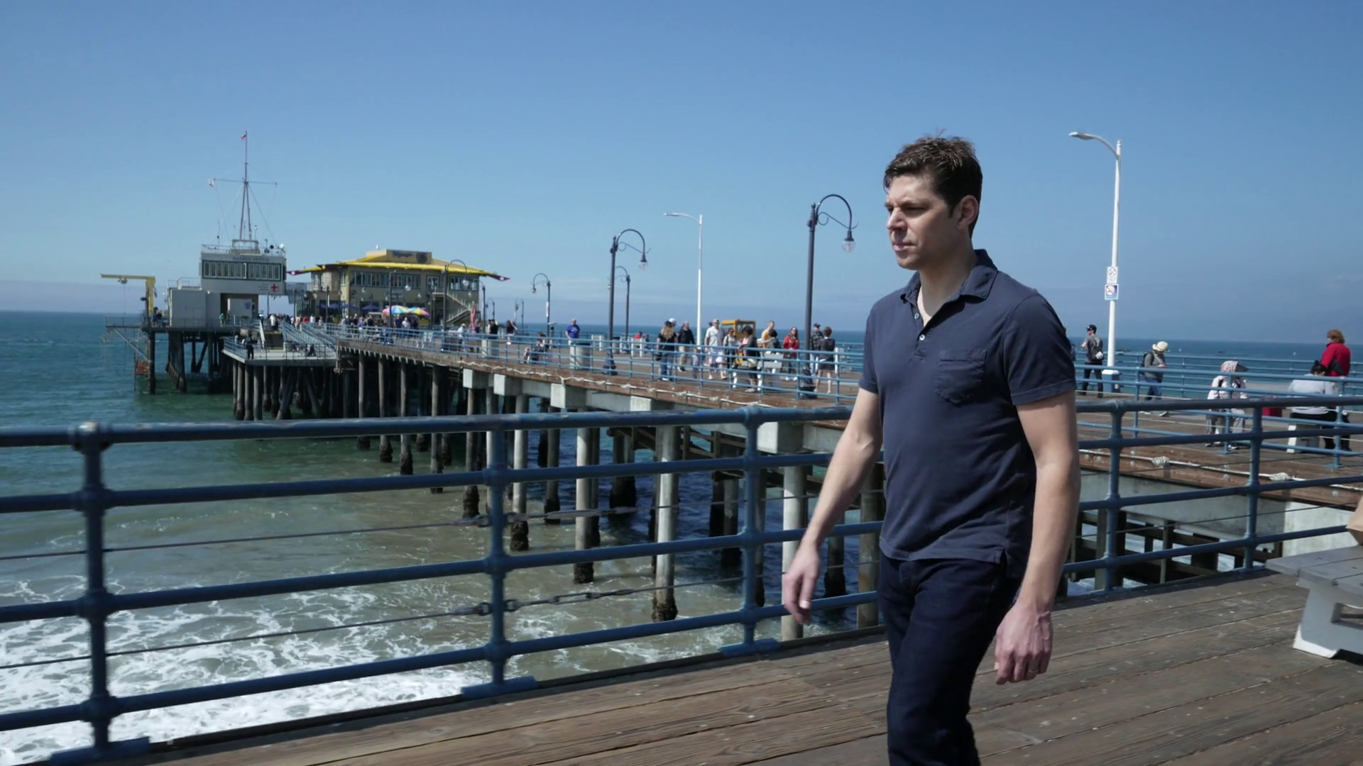 Man Walking Down Pier Sees Waves To Friend Stock Footage SBV-333816951 ...