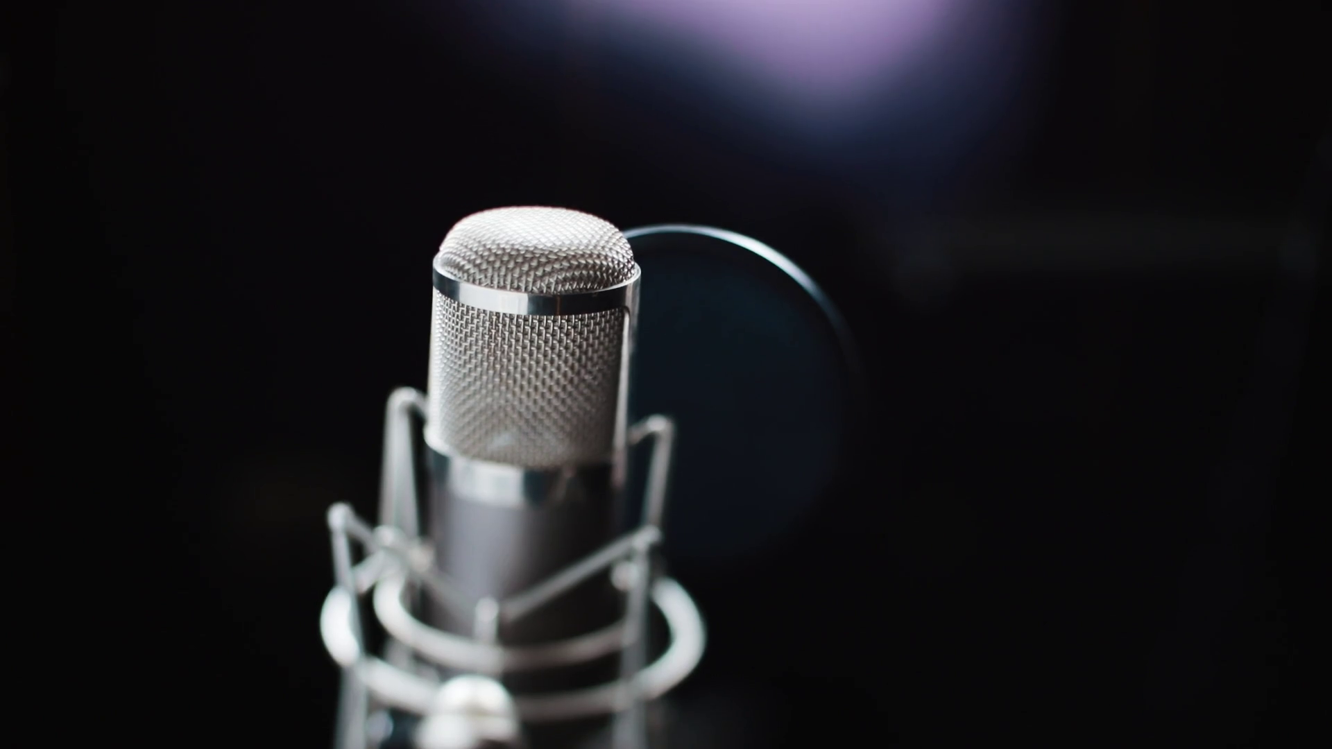 young woman training to make music in professional studio look at ...