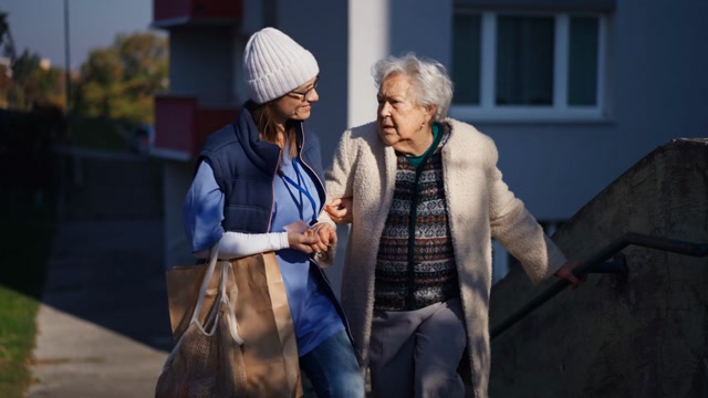 Volunteers Helping Old People Stock Footage: Royalty-Free Video Clips ...
