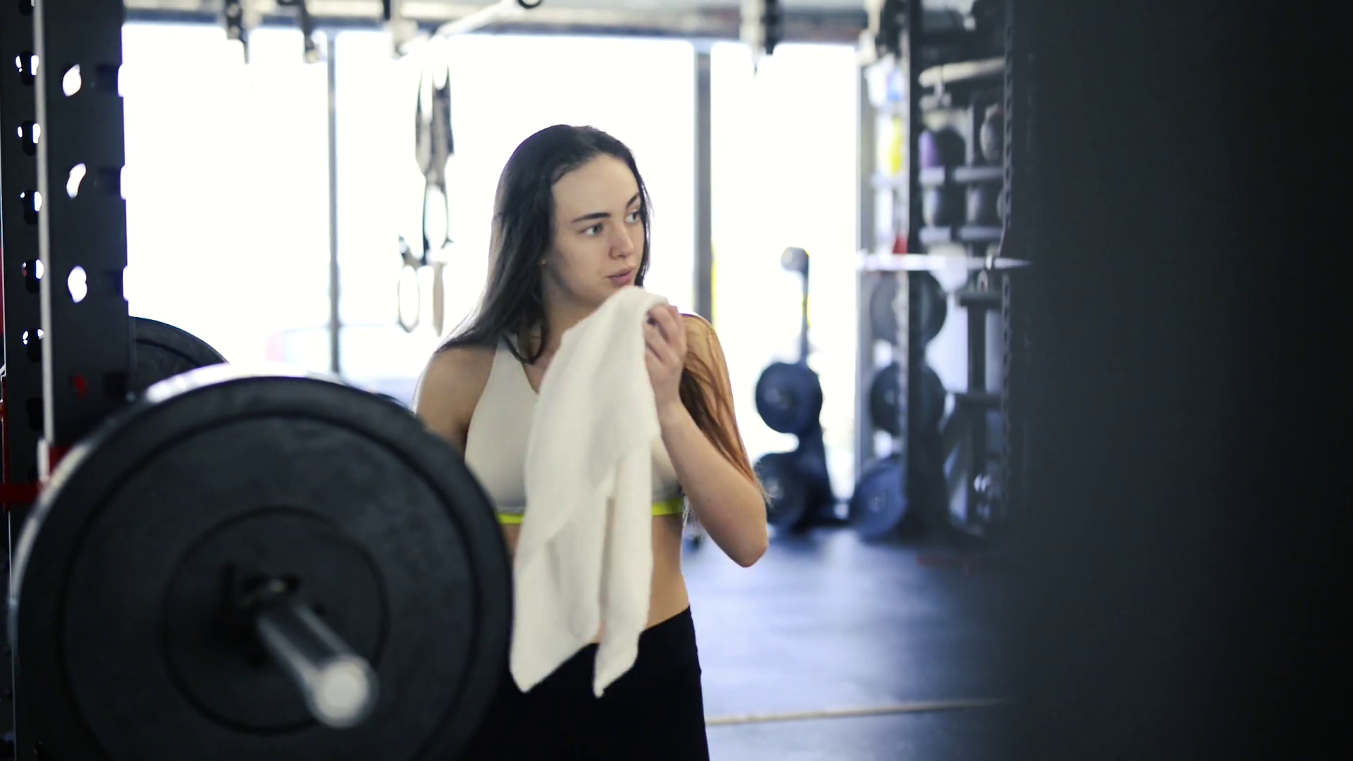 Woman In Gym Wiping Sweat Off Face Drinking Stock Footage SBV-317495625 ...