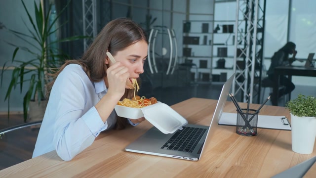 Eating While Working Stock Footage: Royalty-Free Video Clips - Storyblocks