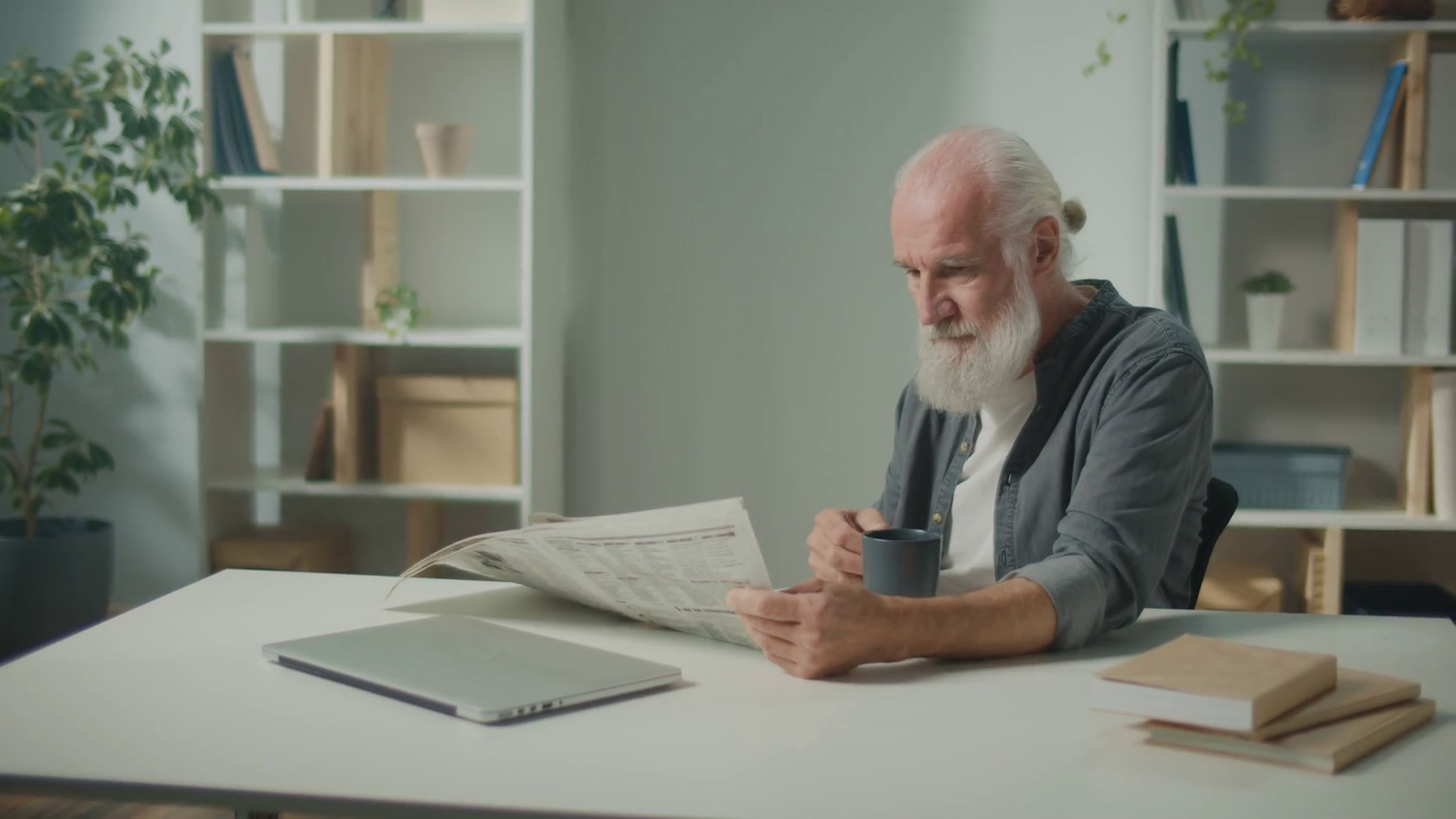 A Serious Smart Old Man Sits At Table Reads Stock Footage SBV-348452468 ...