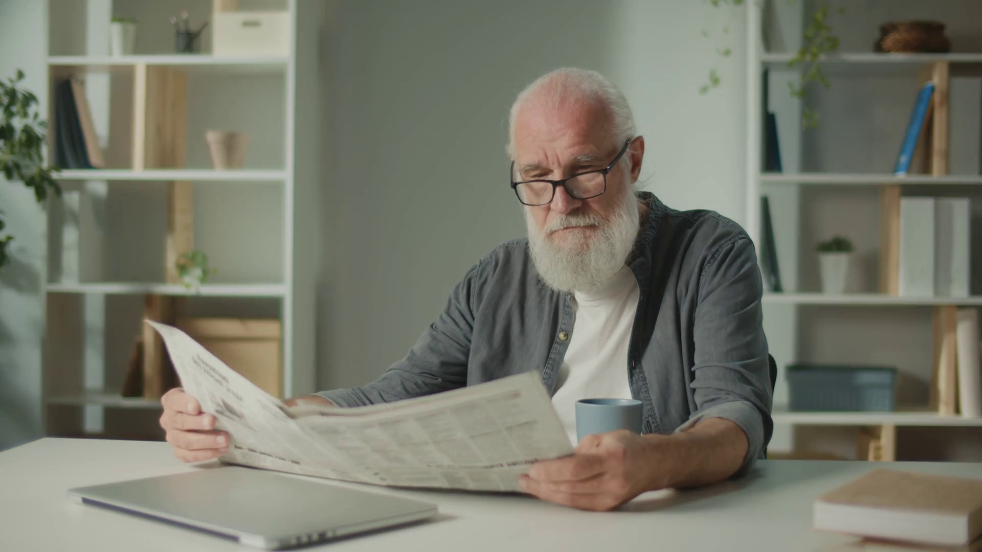 A Serious Smart Old Man Sits At Table Reads Stock Footage SBV-348474504 ...