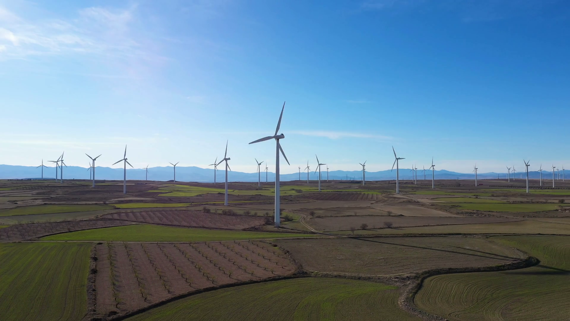 Wind Turbines In Green Field Vineyards Blue Stock Footage SBV-338002943 ...
