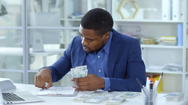 Black Man Counting Money Stock Footage: Royalty-Free Video Clips ...