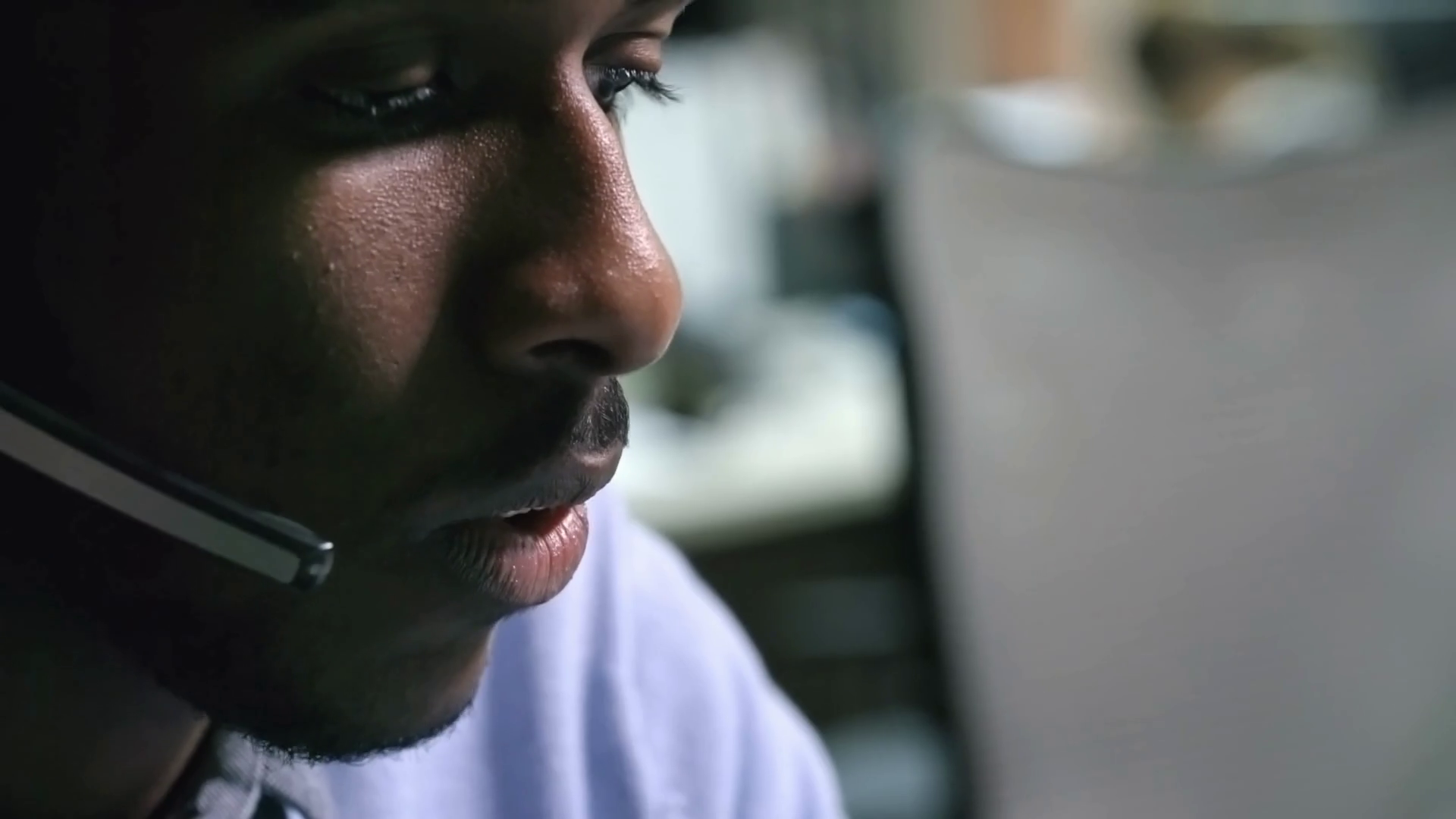 Close up of African customer support agent talking on headset Stock ...