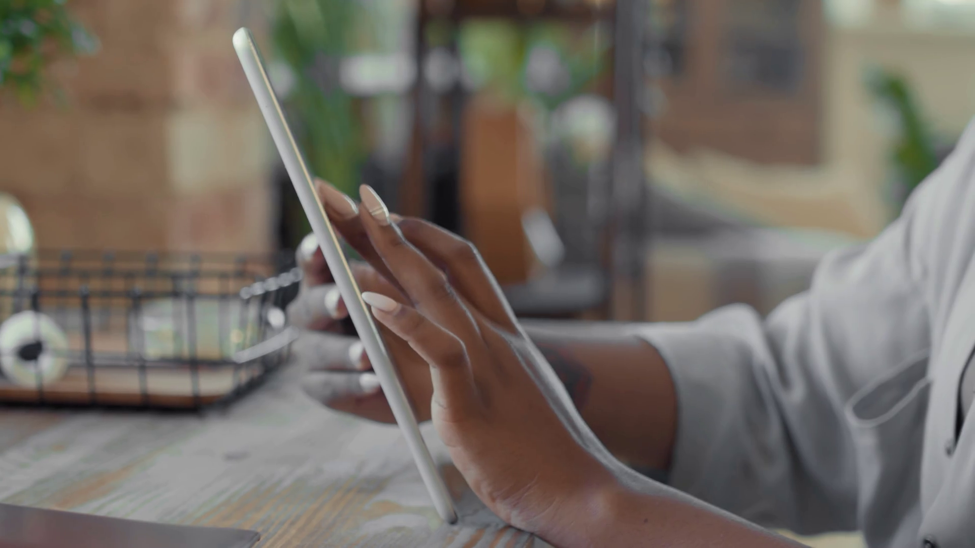 Close up of hands of unrecognizable African-American woman using tablet ...