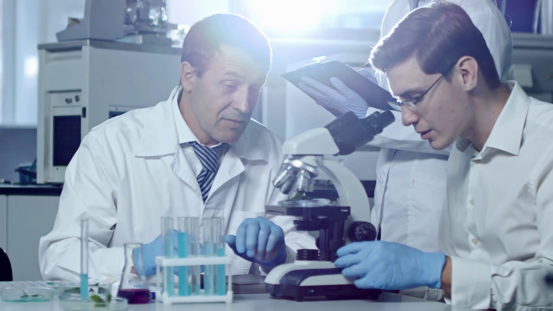 Medium Shot Of Three Chemists In Lab Coats Stock Footage SBV-323650068 ...