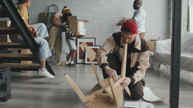 Assembling Furniture Stock Footage: Royalty-Free Video Clips - Storyblocks