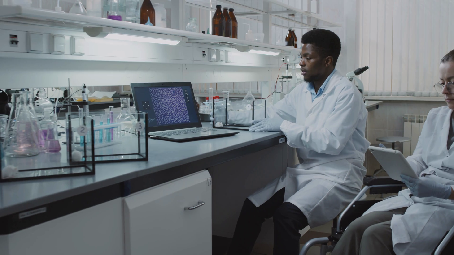 Slowmo Pan Shot Of Disabled Female Scientist Stock Footage SBV ...
