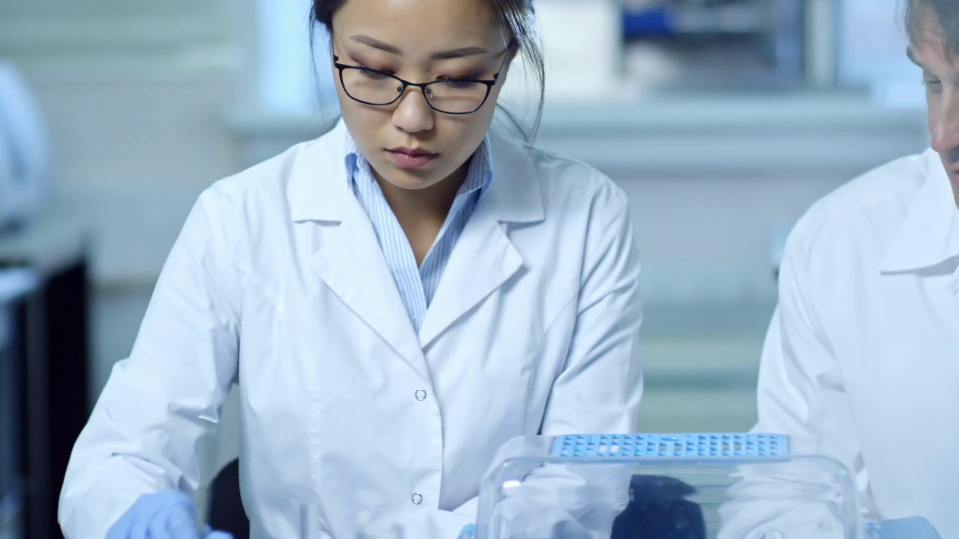 Tracking Shot Of Group Of Three Chemists Stock Footage SBV-323650083 ...