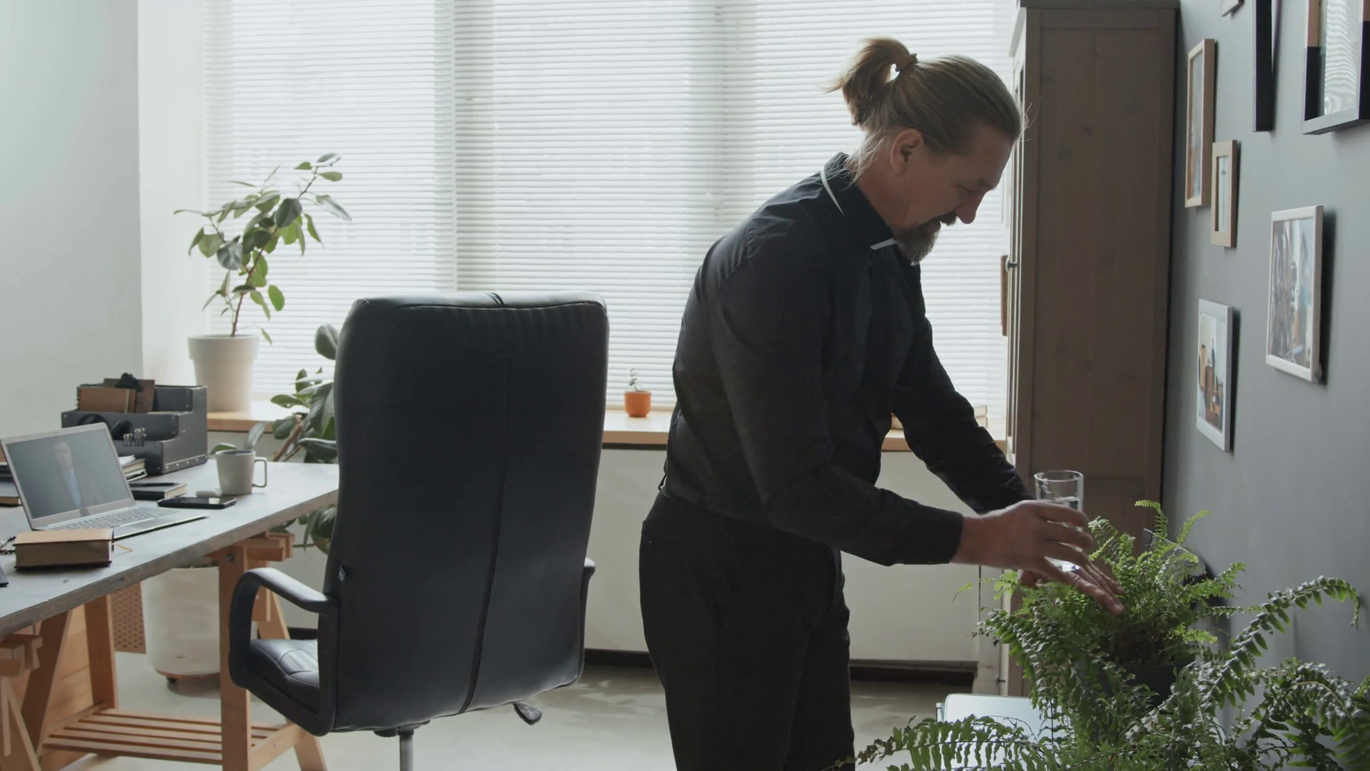 Mature Catholic Priest Tending To Ferns In Stock Footage SBV-347772575 ...
