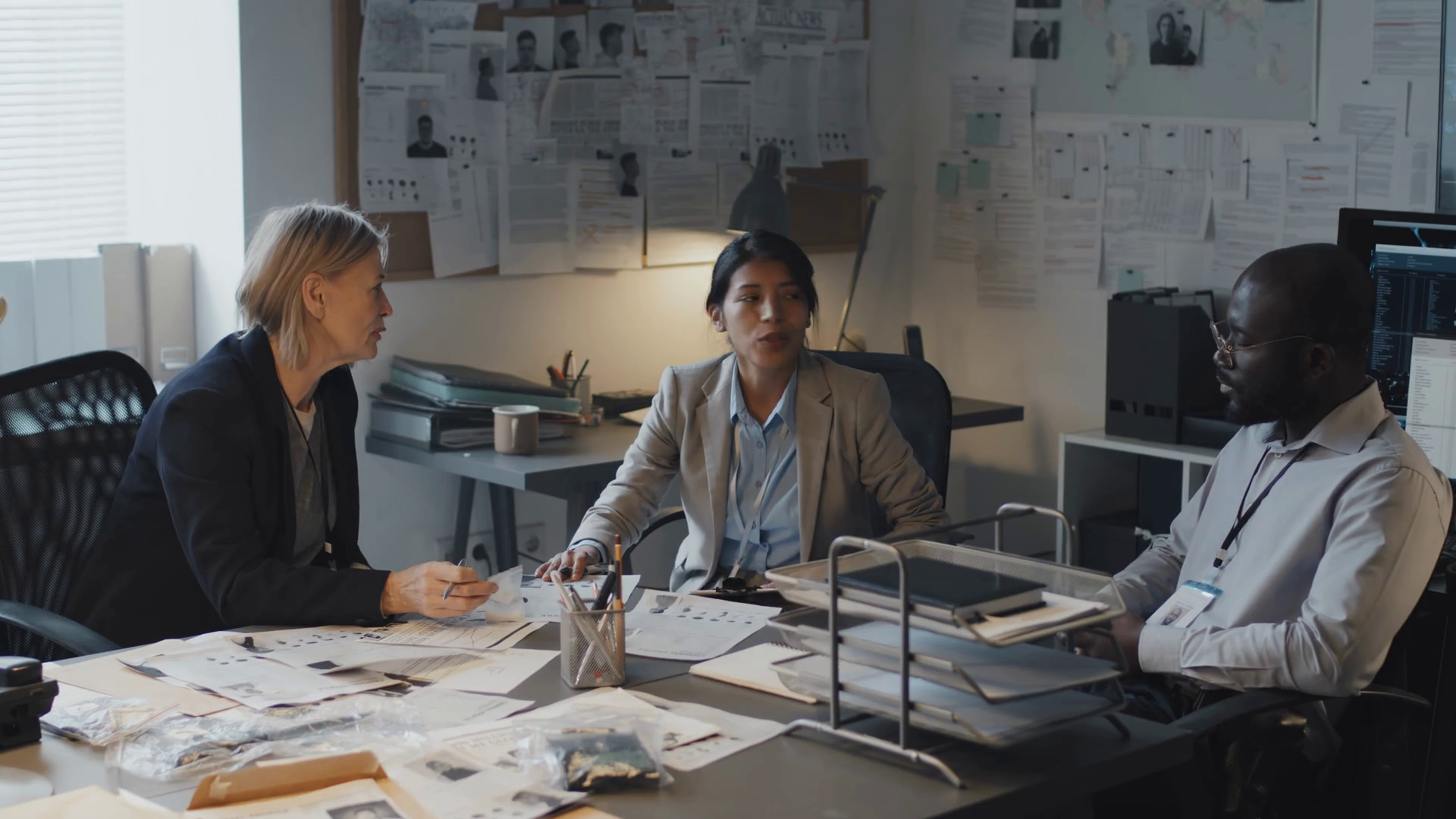 Medium Of Three Diverse Detectives Sitting Stock Footage SBV-347060333 ...