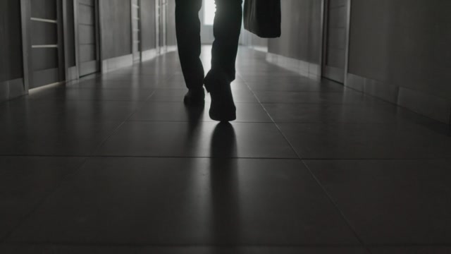 Man Hallway Walking Stock Footage: Royalty-Free Video Clips - Storyblocks