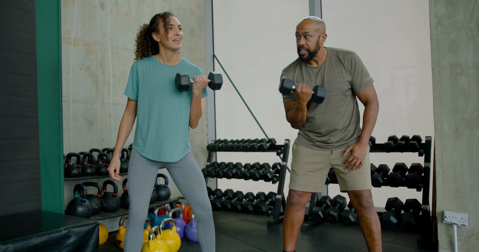 Two People Lifting Dumbbell Weights Stock Footage SBV-351779707 ...