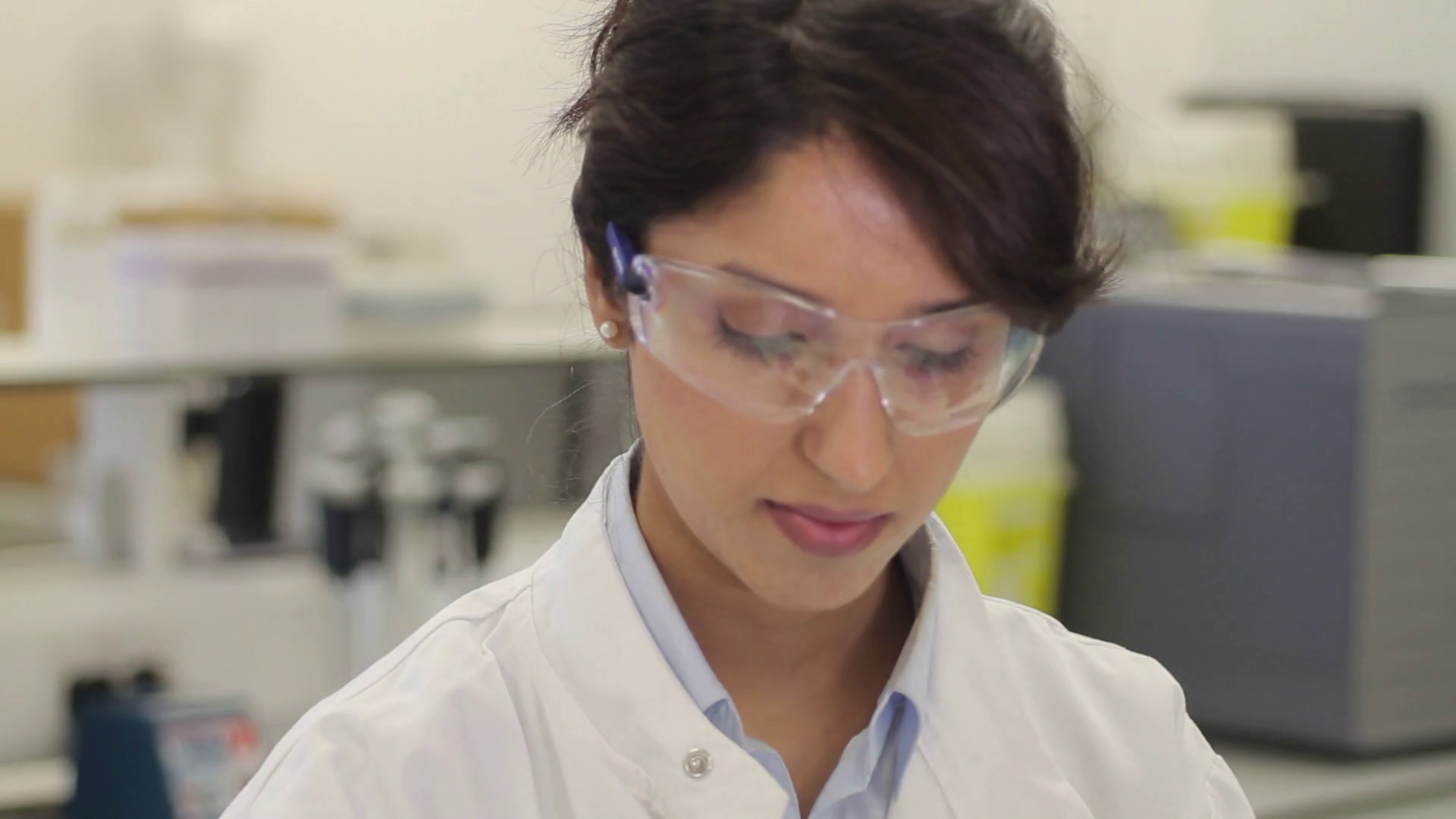 Scientist dropping liquid into vial in genetic laboratory Stock Video ...