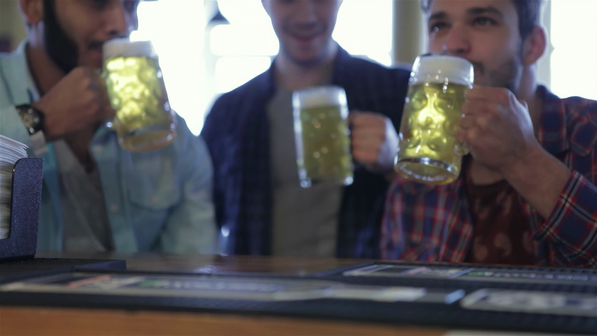 Joyful Men Raise Beer Mugs In Celebration Of Stock Footage SBV ...