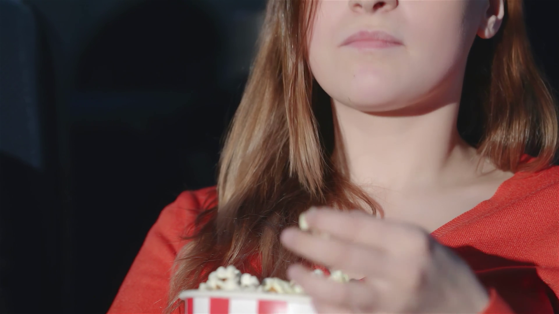 Close-up Of Girl Joyfully Chewing Popcorn In Stock Footage SBV ...