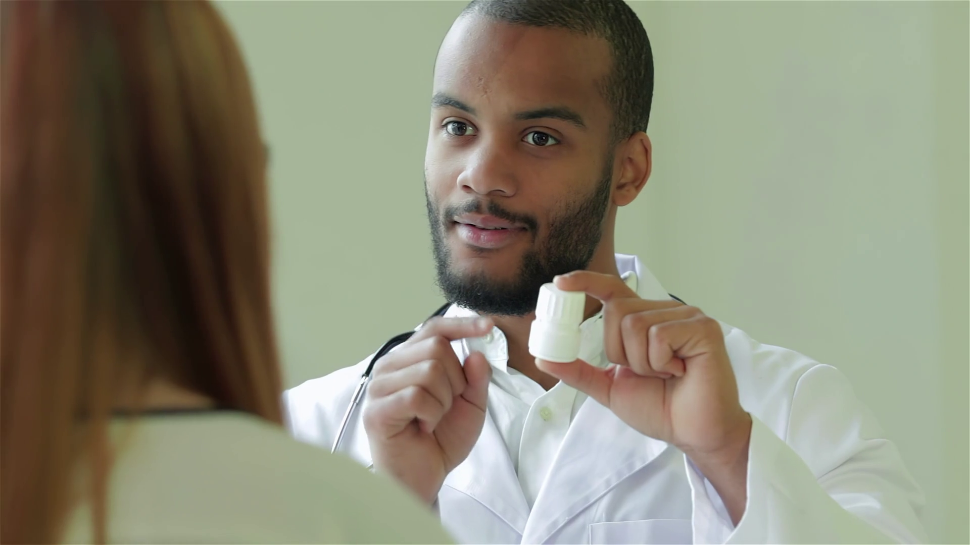 Smiling Doctor Showing Patient Drug Stock Footage SBV-348676723 ...