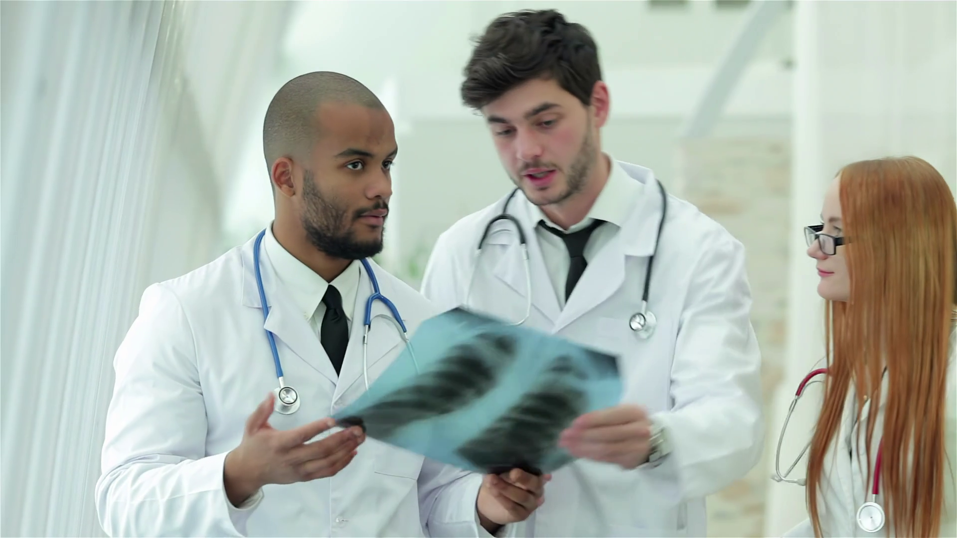 Diverse Team Of Young Doctors Examining Stock Footage SBV-348599667 ...
