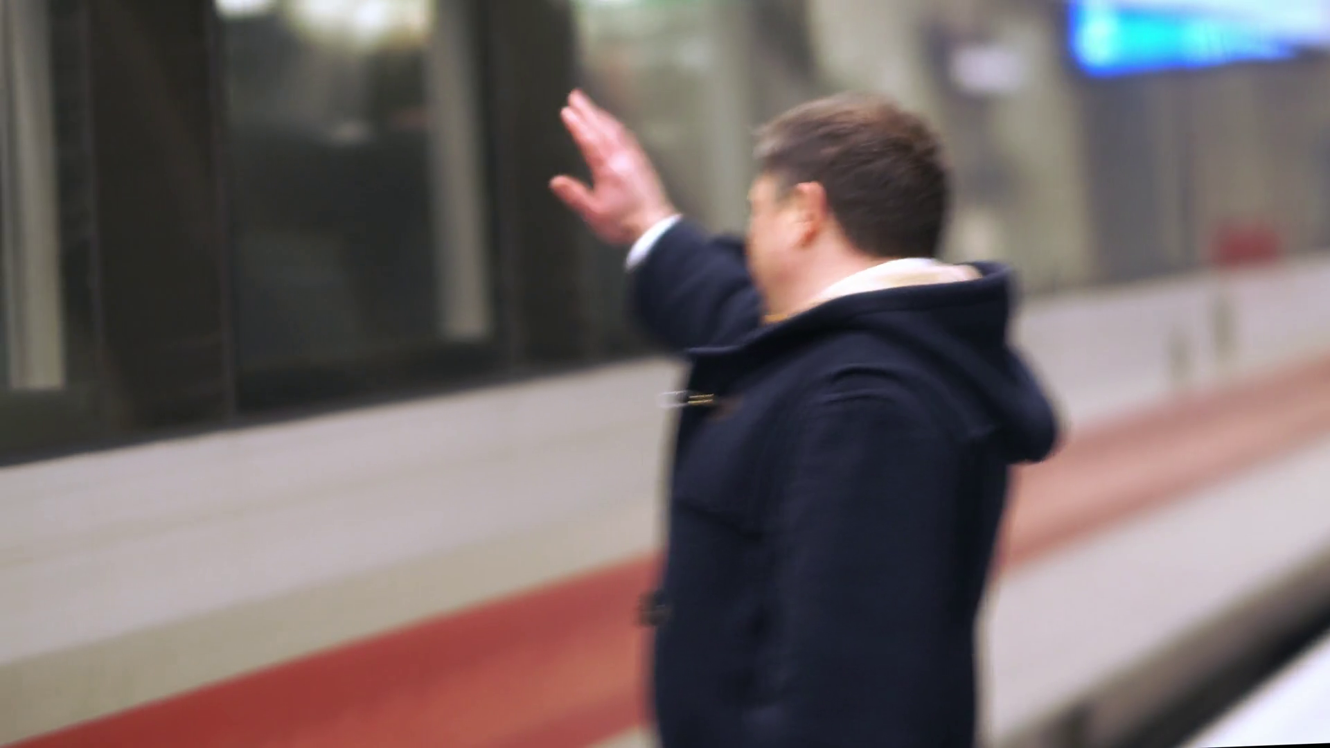 Happy man waving his hand through train window Stock Video Footage 00: ...