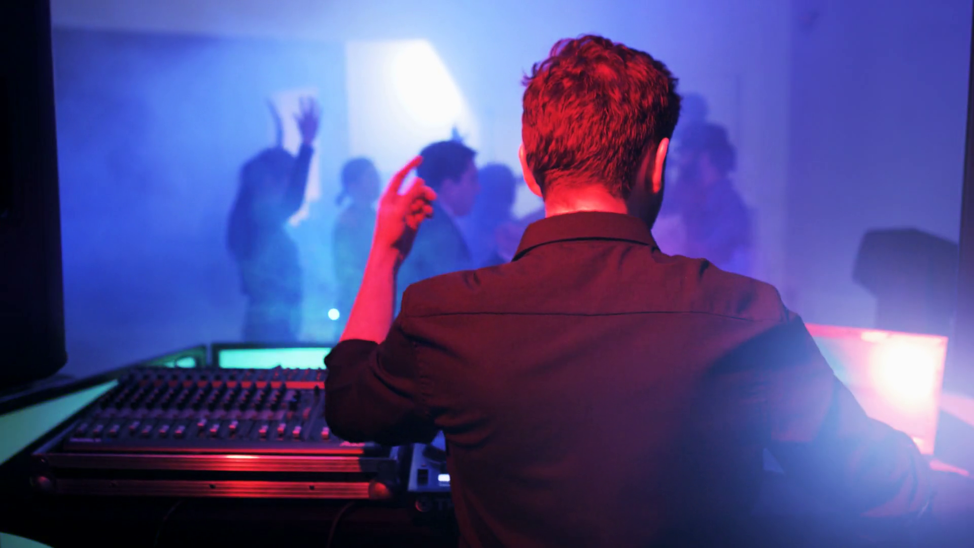 DJ Sitting in Front of the DJ Console Seen from the Back. Wedding party ...