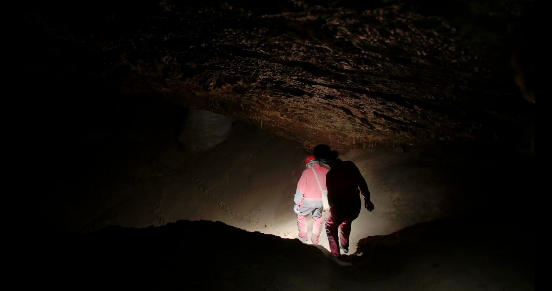 Going Underground Into Cave With Flashlights Stock Footage SBV ...